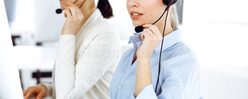 Female Call Operator is Using Computer and Headset for Consulting ...