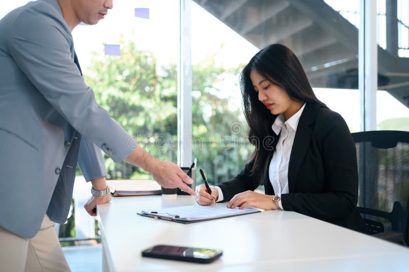 Female Candidate in Formal Suit Signing an Agreement or Application ...
