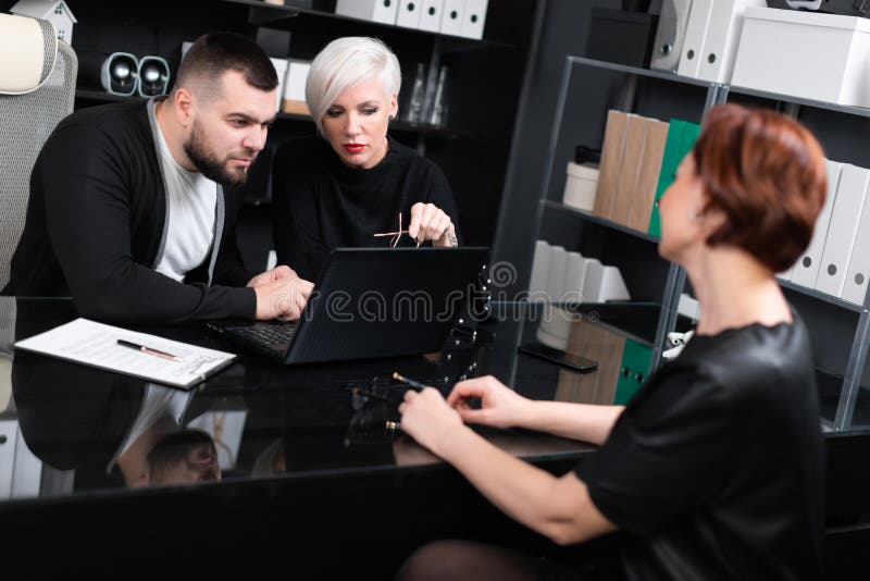 Female Candidate Sits in Front of Two Young Men at Interview Stock ...