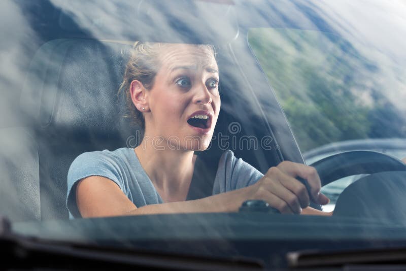Female car driver in panic stock photo. Image of attractive - 262492376