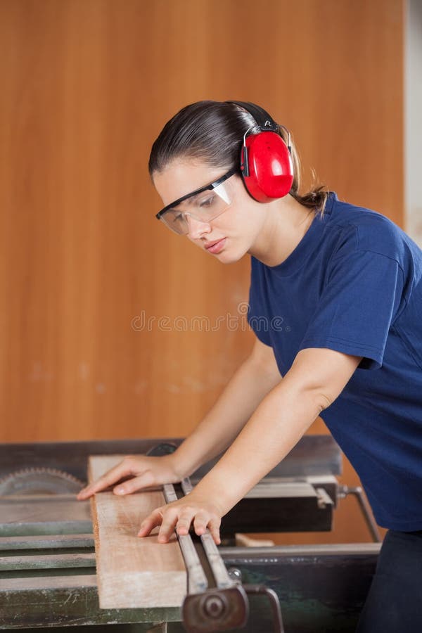 Female Carpenter Cutting Wood with Tablesaw Stock Image - Image of ...