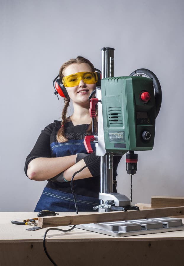 Female Carpenter and Drilling Machine. Stock Photo - Image of beautiful ...