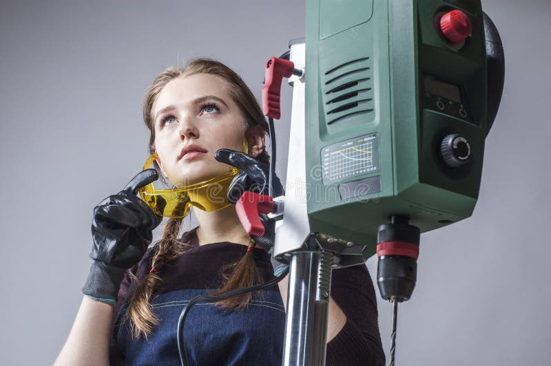 Female Carpenter And Drilling Machine. Stock Image - Image of equipment ...