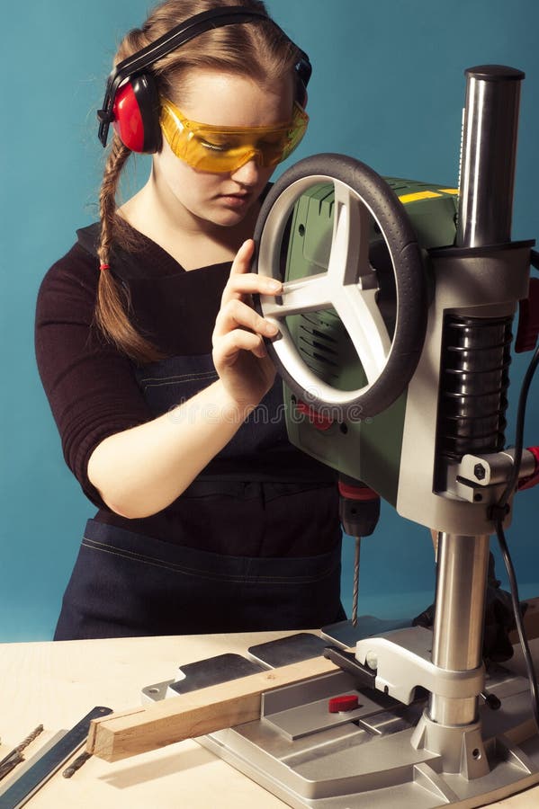 Female Carpenter and Drilling Machine. Stock Photo - Image of ...