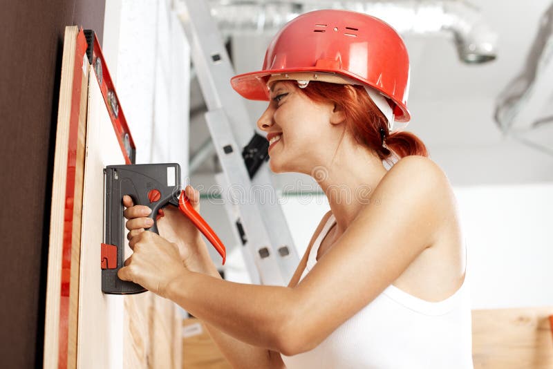 Female carpenter on duty stock image. Image of holding - 21642089