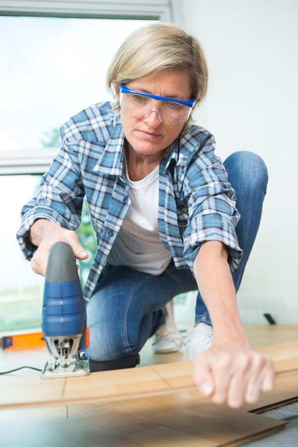 Female Carpenter Using Bandsaw at Construction Site Stock Image - Image ...