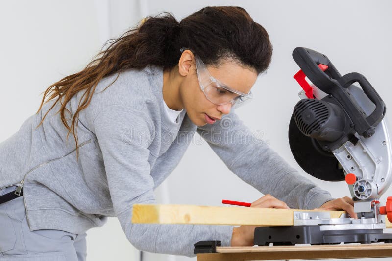 Female carpenter at work stock image. Image of position - 118902045
