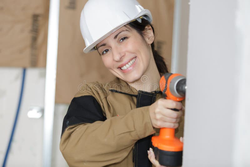 Female Carpenter at Work Using Hand Drilling Machine Stock Image ...