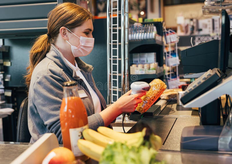 Female Cashier in Mask Using Barcode Scanner Stock Photo - Image of ...