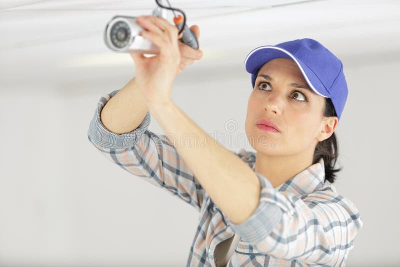 Female Cctv Installer Checking Security Camera Stock Image - Image of ...