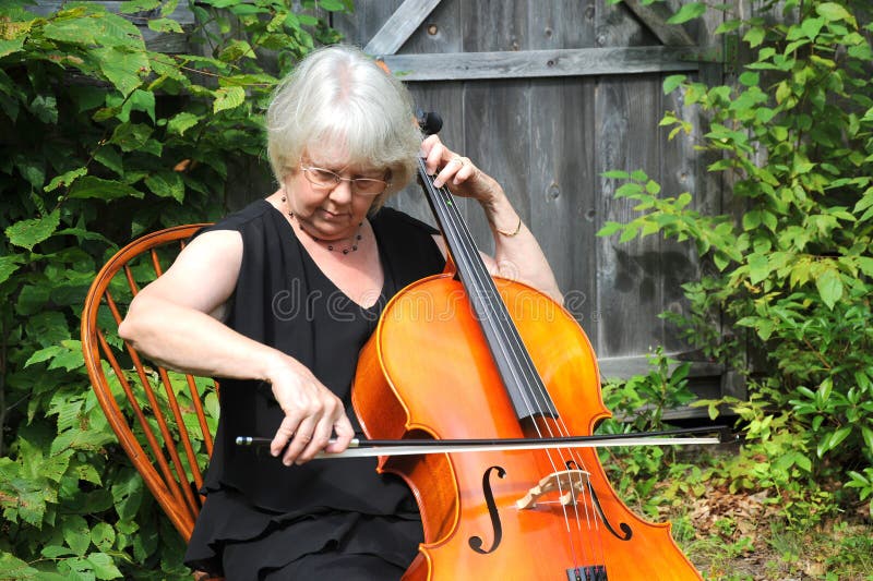Female cellist stock image. Image of senior, sounds, people - 21529019