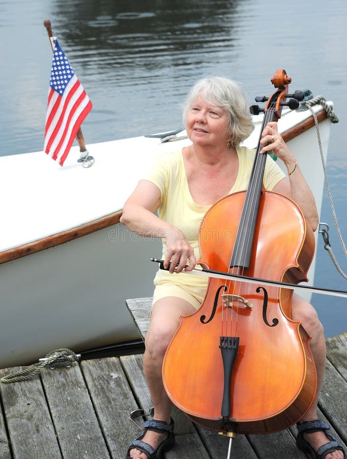 Female cellist. stock image. Image of musician, wooden - 21838273