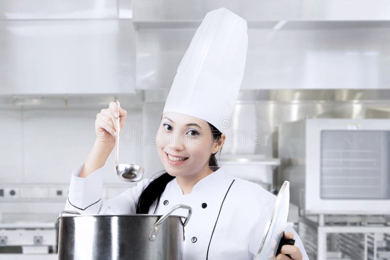 Female Chef Cooking with Pot in Kitchen Stock Photo - Image of ...