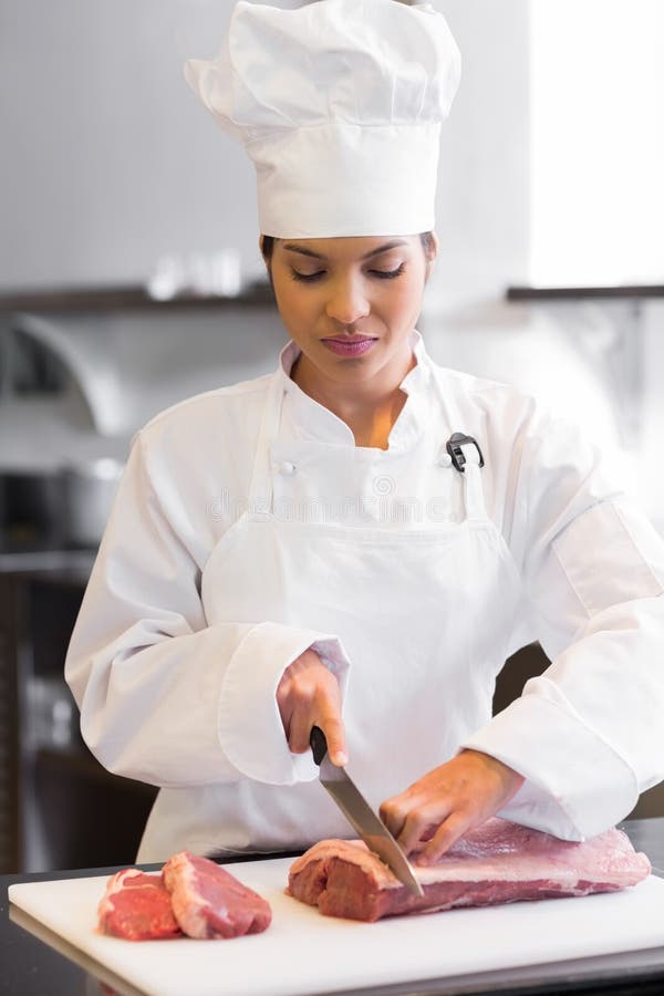 Female Chef Cutting Meat in Kitchen Stock Photo - Image of board ...