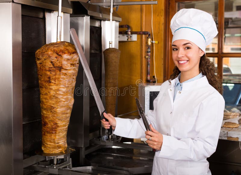 Female Chef Cutting Meat for Shawarma Stock Photo - Image of away ...