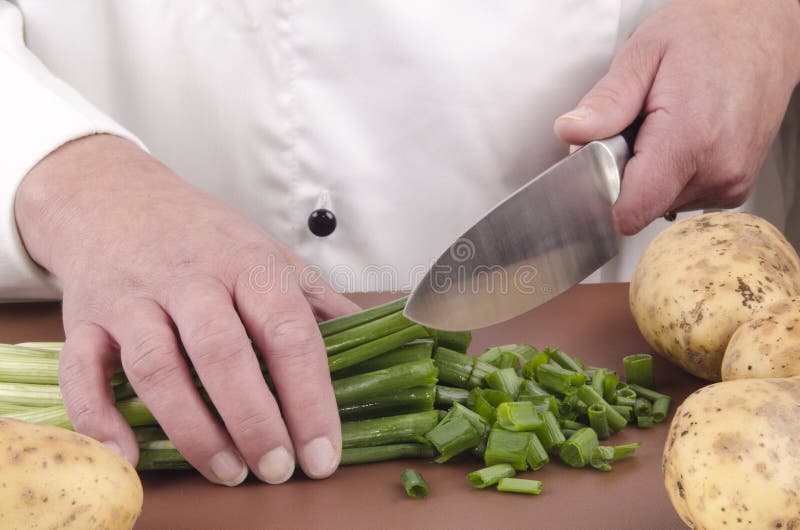 Female Chef Cutting Spring Onions with a Kitchen Knife Stock Image ...