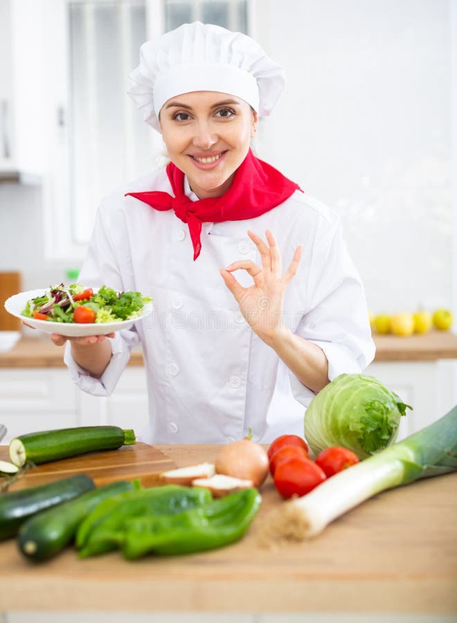 Female Chef Demonstrating Excellent Salad in the Kitchen Stock Photo ...