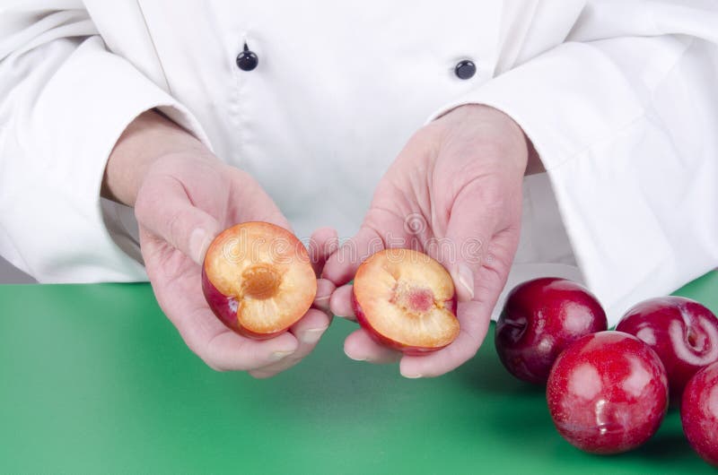 Female Chef with a Divided Plum Stock Photo - Image of brown, female ...
