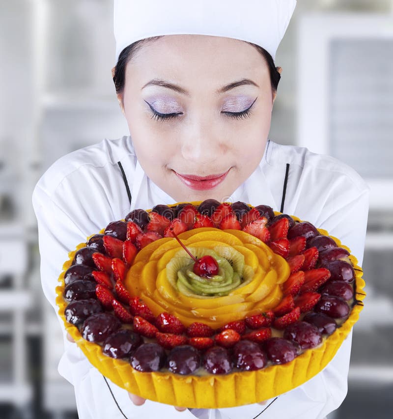 Female Chef Holding a Delicious Cake Stock Image - Image of decorate ...