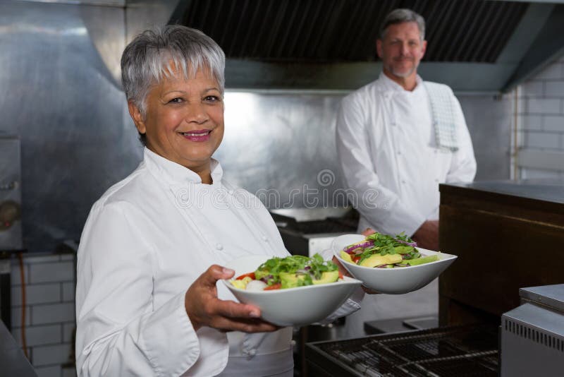 Female Chef Holding Food Plate Stock Image - Image of chefs, food ...