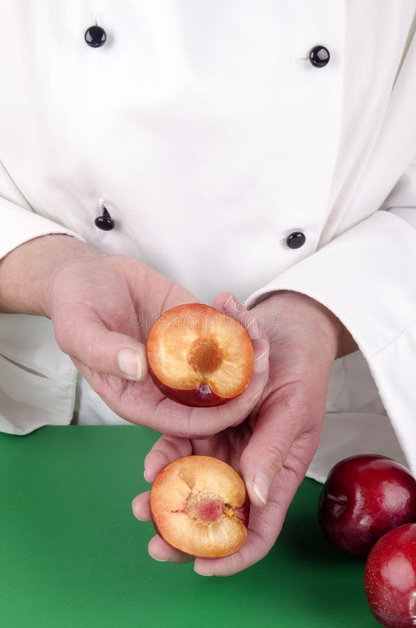 Female Chef Holds a Cut through Plum Stock Image - Image of fresh, diet ...