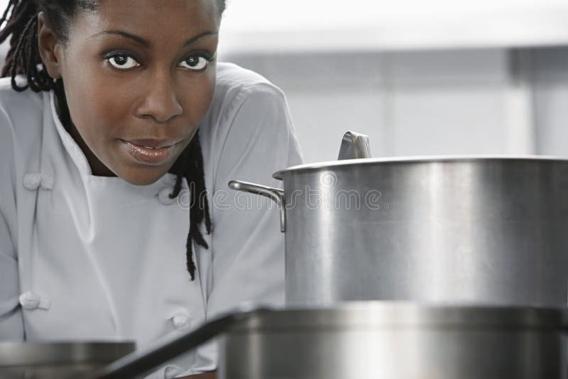 Female Chef in Kitchen stock image. Image of indoors - 33834187