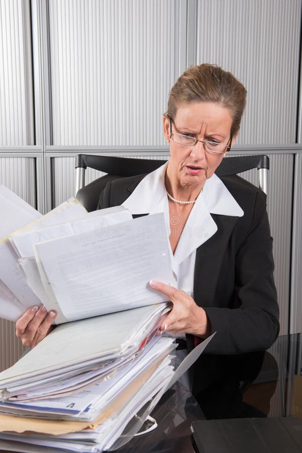 Female Chef in the Office with a Lot of Papers Stock Photo - Image of ...