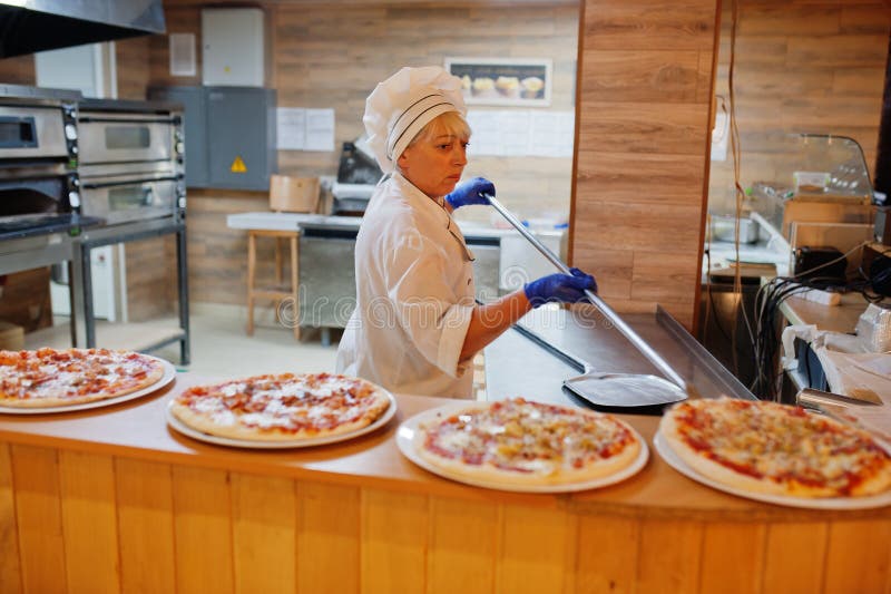 Female Chef Preparing Pizza in Restaurant Kitchen Stock Image - Image ...