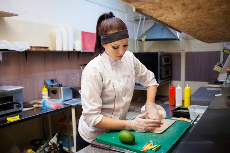 Female Chef Preparing a Sushi Restaurant in the Kitchen Stock Photo ...