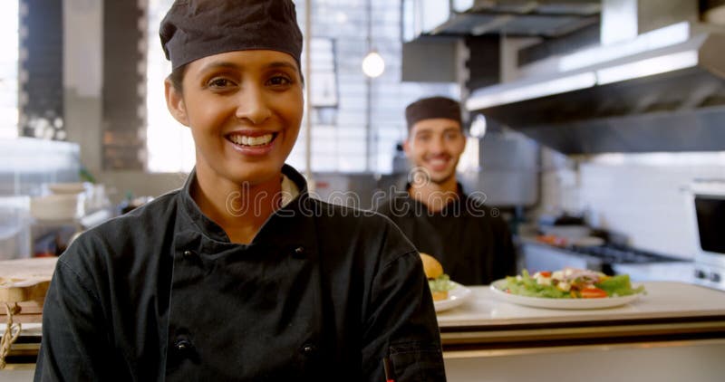Smiling Chefs Presenting Their Dish at Commercial Kitchen 4k Stock ...