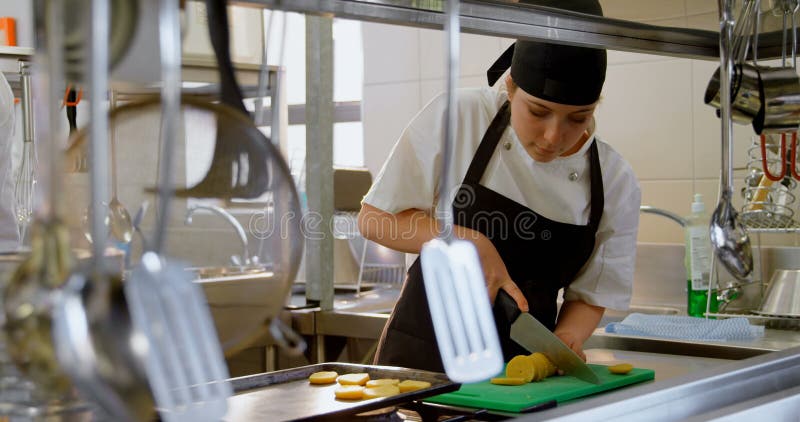 Female Chef Working in Kitchen at Restaurant 4k Stock Image - Image of ...