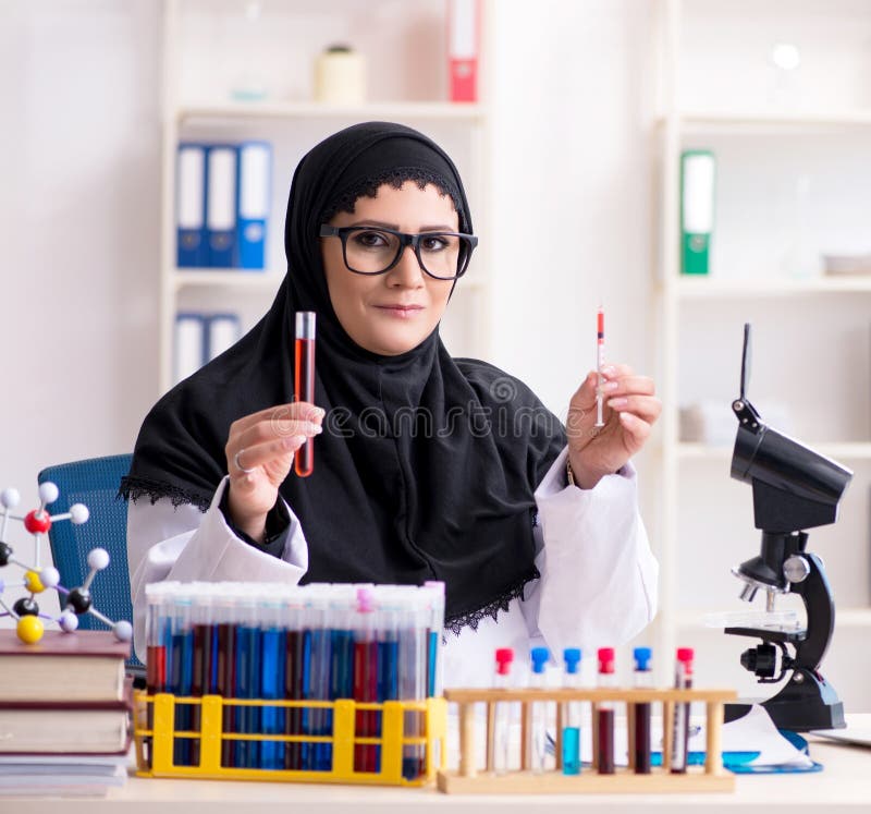 Female Chemist in Hijab Working in the Lab Stock Photo - Image of ...