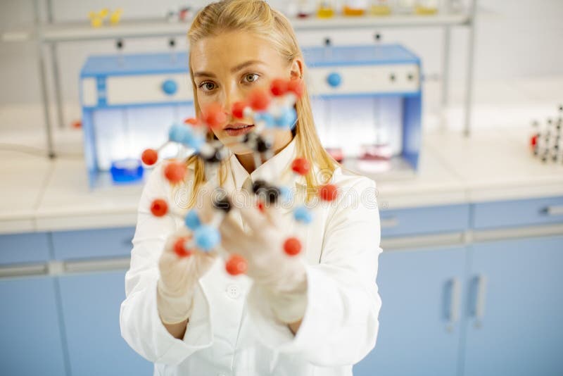 Female Chemist Hold Molecular Model in the Lab Stock Photo - Image of ...
