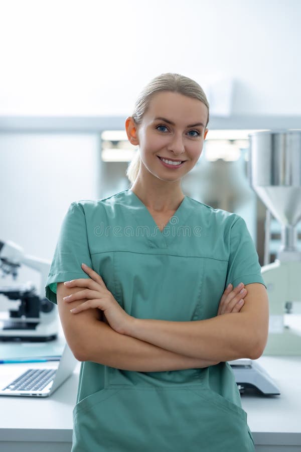 Female Chemist in Lab Coat Crossed Hands Looking at Camera in ...