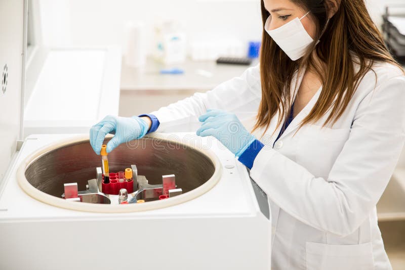 Female Chemist Using Centrifuge in a Lab Stock Image - Image of ...
