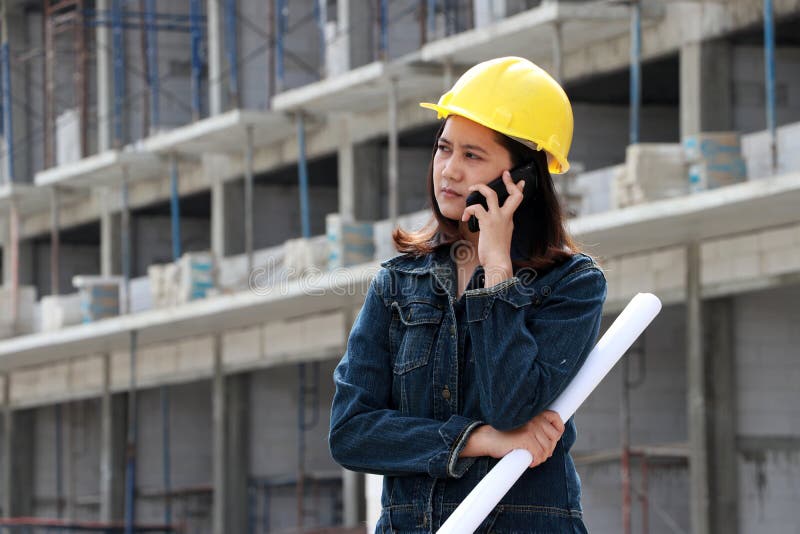 Female Civil Engineer or Architect with Yellow Helmet, Standing and ...