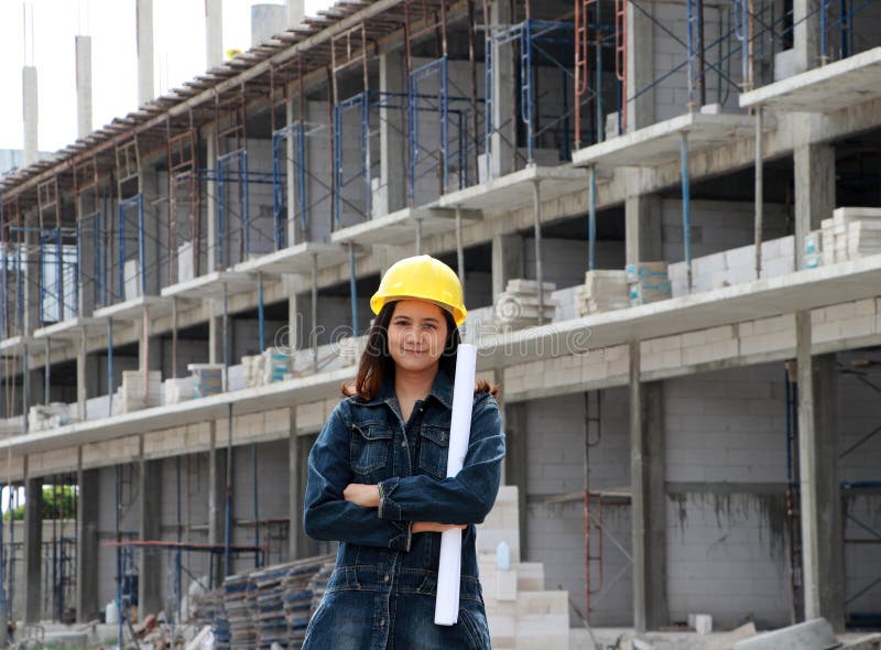 Female Civil Engineer or Architect with Yellow Helmet, Standing and ...