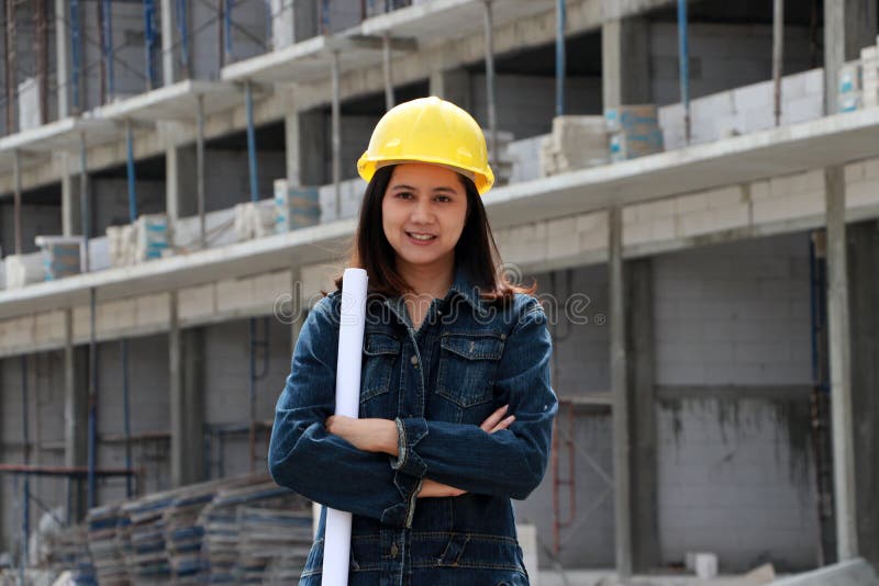 Female Civil Engineer or Architect with Yellow Helmet, Standing and ...