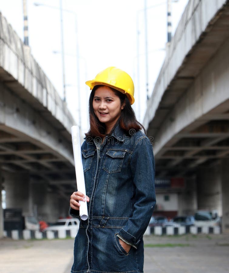 Female Civil Engineer or Architect with Yellow Helmet, Standing and ...