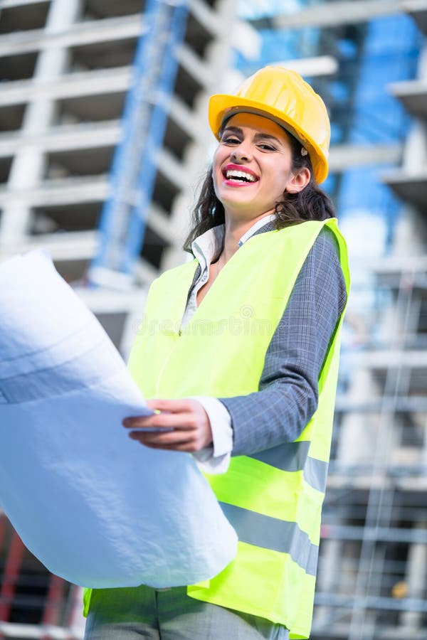 Female Civil Engineer Studying Drafts Visiting Construction Site Stock ...