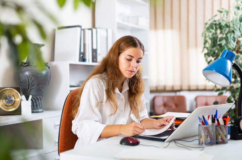 Female Clerical Worker Sitting at Desk in Office Stock Image - Image of ...