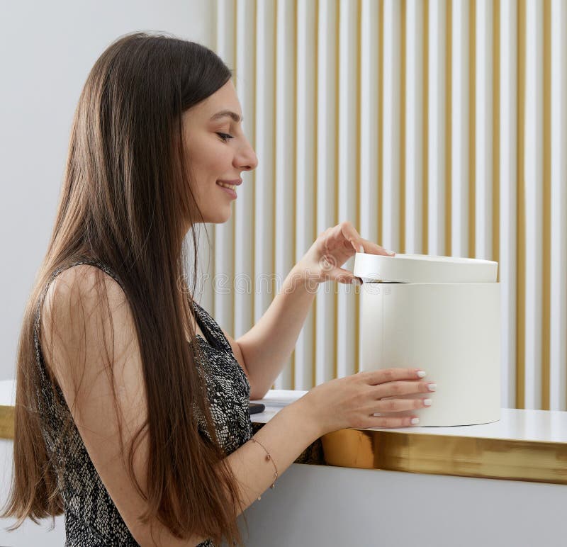 Female Receptionist at Reception Desk with a Client in a Modern Office ...