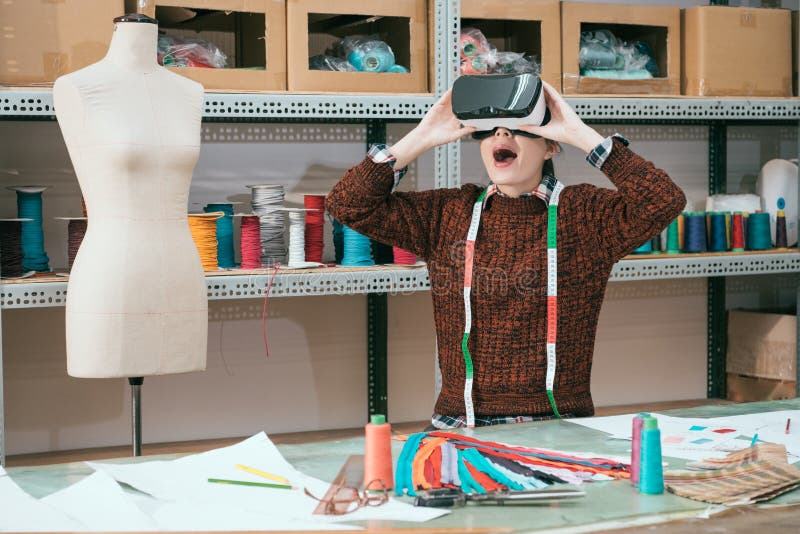 Female Clothing Maker Using VR Technology Goggles Stock Image - Image ...