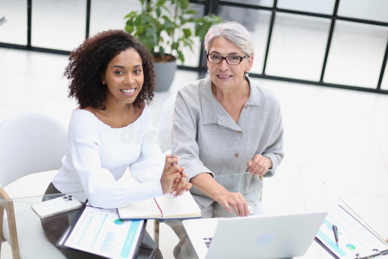 Female Colleagues Met in the Office Hall Discussing Work Issues Stock ...