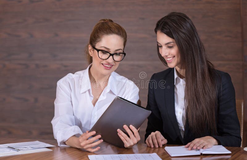 Female Colleagues Sharing Ideas about Work Stock Image - Image of ...