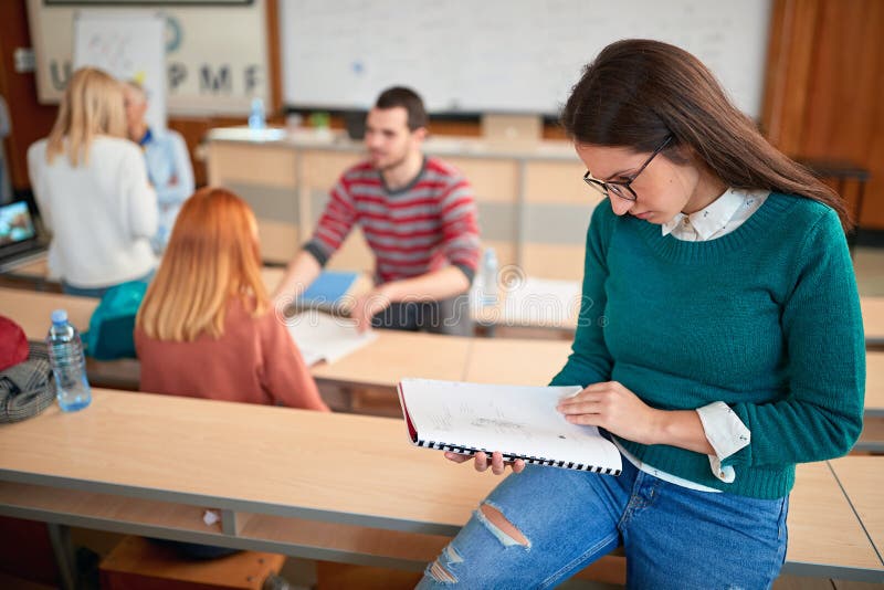 Female College Student in a Classroom Stock Photo - Image of female ...