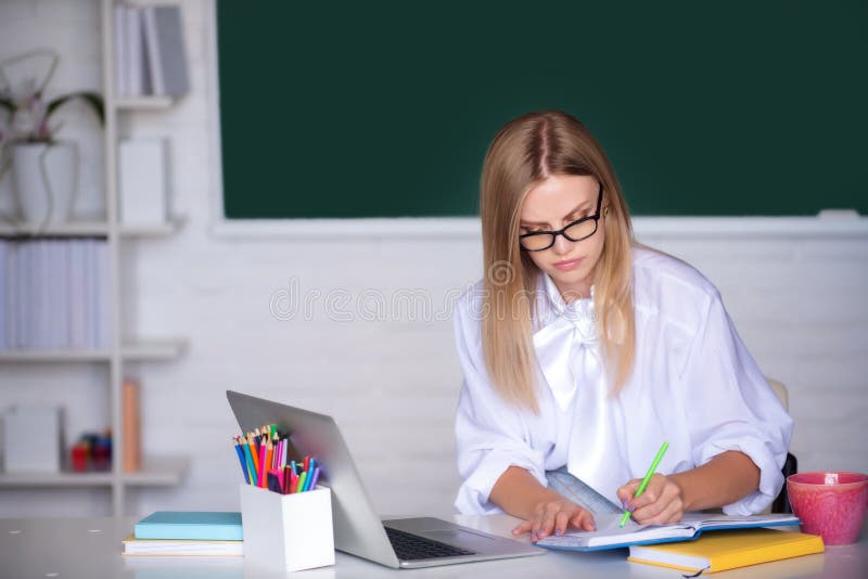 Female College Student Preparing for Test or Exam, Writing, Using ...