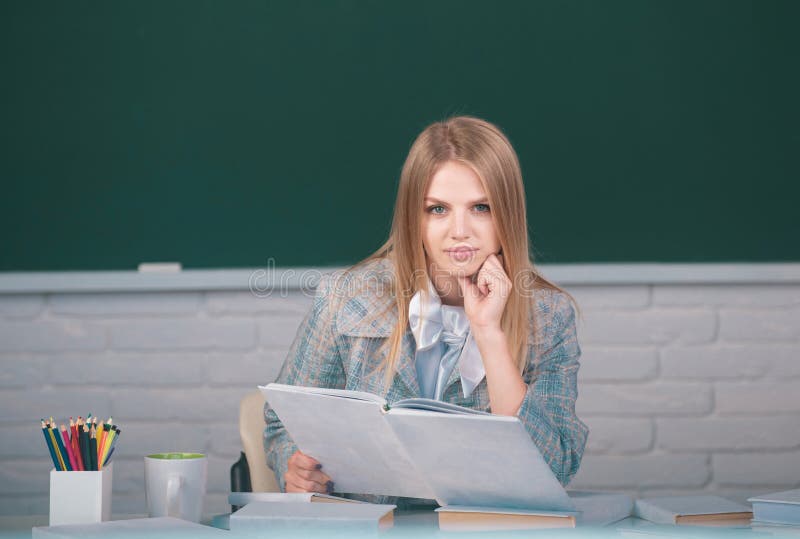 Female College Student Reading Book in Classroom, Preparing for Exam ...
