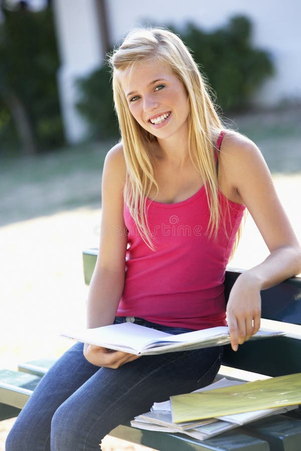 Female College Student Sitting on Bench with Book Stock Photo - Image ...