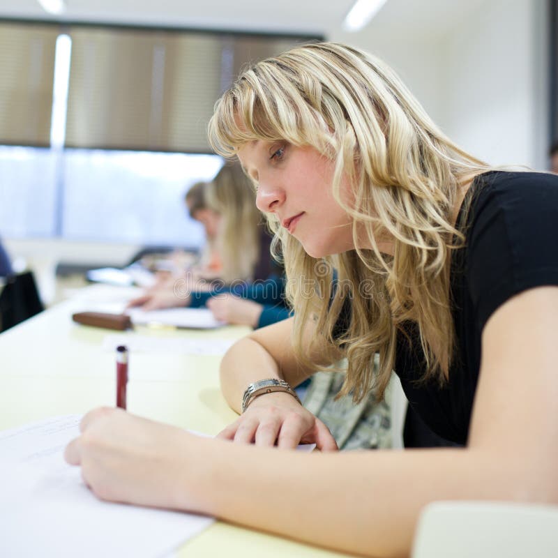 Female College Student Sitting in a Classroom Stock Photo - Image of ...